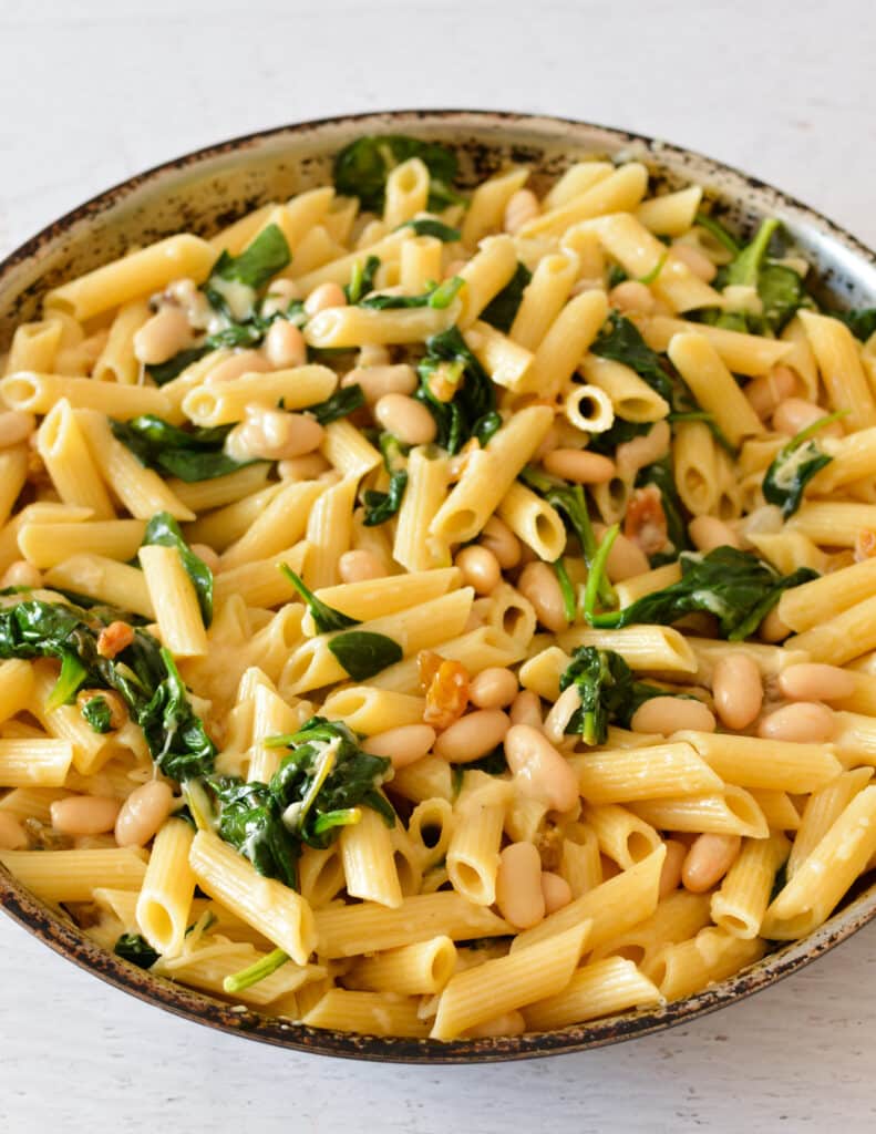 Spinach Pasta with White Beans & Parmesan - caramel and cashews